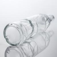 China Highly Durable Liquor Glass Bottle with Embossed Pattern and Cork Stopper Perfect for sale