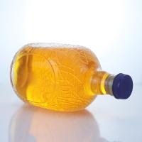 China Unique Round Shape Embossed Food Grade Rum Vodka Whisky Tequila Gin Glass Bottle with Cork Perfect for sale