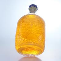 China Unique Round Shape Embossed Food Grade Rum Vodka Whisky Tequila Gin Glass Bottle with Cork Perfect for sale