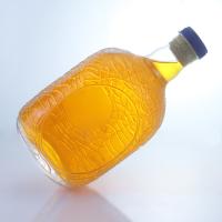 China Unique Round Shape Embossed Food Grade Rum Vodka Whisky Tequila Gin Glass Bottle with Cork Perfect for sale