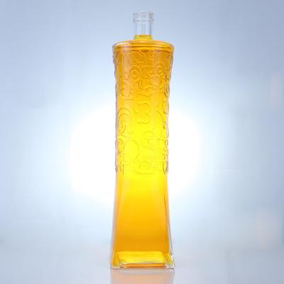 China Industrial Liquor Glass Bottle with Unique Shape and Embossed Super Flint Material for sale