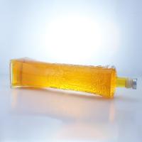 China Industrial Liquor Glass Bottle with Unique Shape and Embossed Super Flint Material for sale