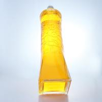 China Industrial Liquor Glass Bottle with Unique Shape and Embossed Super Flint Material for sale