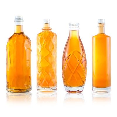 China Unique Design Glass Bottle for Champagne Gin Rum Brandy Whisky in Super Flint Material for sale
