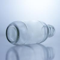 China 300ml Round Glass Milk Bottle with Lid Liquor Storage Solution Decal Surface Handling for sale
