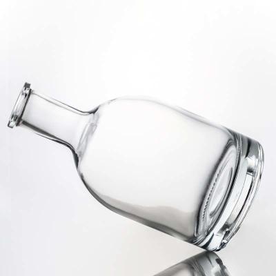 China Custom Shape 500ml 700ml 750ml Round Liquor Glass Bottle with Cork Stopper Industrial for sale