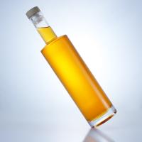 China Customized Glass Spirit Bottle with Heavy Base and Cork Stopper for sale