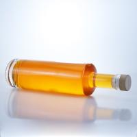 China Customized Glass Spirit Bottle with Heavy Base and Cork Stopper for sale