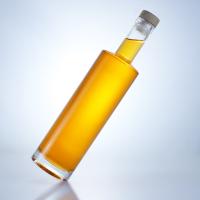 China Customized Glass Spirit Bottle with Heavy Base and Cork Stopper for sale