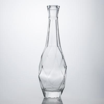 China Industrial Liquor Custom Shape Pear Embossed Super Flint Material Glass Bottle with Cork for sale