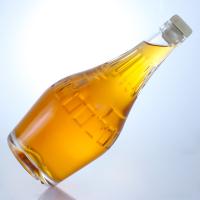 China Industrial Liquor Glass Bottle with Custom Embossed Body and Cork Stopper for sale