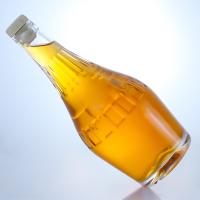 China Industrial Liquor Glass Bottle with Custom Embossed Body and Cork Stopper for sale