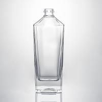 China Clear Glass Liquor Bottle with Embossed Body and Cork Stopper for sale