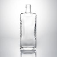 China Clear Glass Liquor Bottle with Embossed Body and Cork Stopper for sale