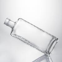 China Clear Glass Liquor Bottle with Embossed Body and Cork Stopper for sale