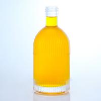 China Industrial Liquor Glass Bottle with Screw Cap Stripes and Customized Logo for sale