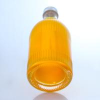China Industrial Liquor Glass Bottle with Screw Cap Stripes and Customized Logo for sale