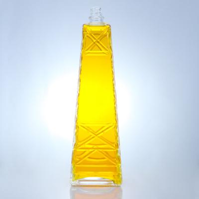 China Clear Unique Shaped 700ml 75cl Embossed Super Flint Rum Vodka Whisky Glass Bottle With Screw Cap for sale