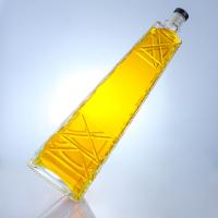 China Clear Unique Shaped 700ml 75cl Embossed Super Flint Rum Vodka Whisky Glass Bottle With Screw Cap for sale