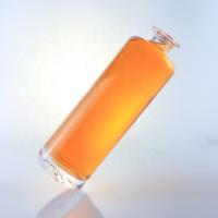 China 750ml Unique Round Flint Glass Bottle with Customized Logo and Cork for sale