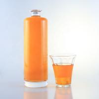 China 750ml Unique Round Flint Glass Bottle with Customized Logo and Cork for sale