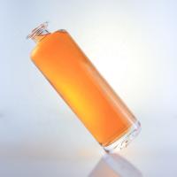 China 750ml Unique Round Flint Glass Bottle with Customized Logo and Cork for sale