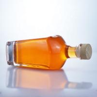 China Hot Stamping Surface Handling Clear or Customized Color 750ml Rum Vodka Liquor Glass Bottle for sale