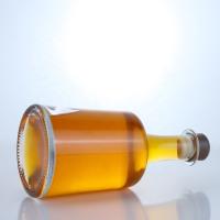 China Surface Handling Hot Stamping Glass Bottle With Cork for Vodka Gin Rum Whiskey for sale