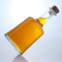China Surface Handling Hot Stamping Glass Bottle With Cork for Vodka Gin Rum Whiskey for sale
