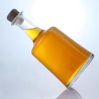 China Surface Handling Hot Stamping Glass Bottle With Cork for Vodka Gin Rum Whiskey for sale