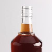 China 2022 Thick Bottom Embossed Glass Bottle Clear Flint for Gin Whisky Rum Tequila Brandy for sale