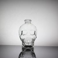 China Exquisite Frost Glass Skull Face Bottle For Liquor Decal Surface Handling for sale