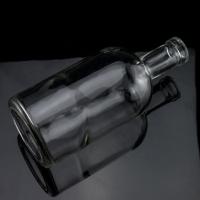 China Base Material Glass Liquor Bottle 500ml 700ml 750ml with Cork Seal and Round Shape for sale