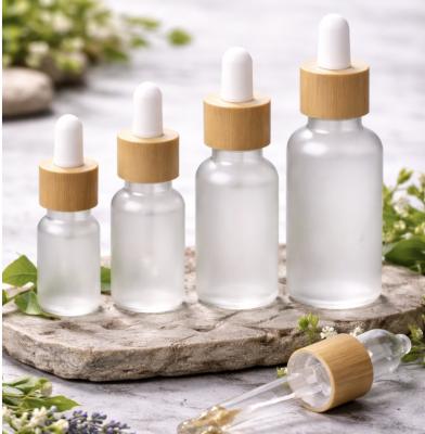 China Serum Glass Dropper Bottle Plastic Shoulder Lid Rubber Printing Packaging for Essential Oils Cosmetics for sale