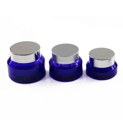 China Empty Inclined Shoulder Glass Cosmetic Jars With Sliver Screw Cap for sale
