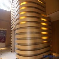 China Suit for Airport Building Materials Wood Grain Color Suspended Aluminium Curved Tube Baffle Ceiling for sale