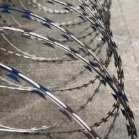 China Stainless Steel 304 Concertina Razor Wire High Security Spiral Barrier For Border Protection for sale
