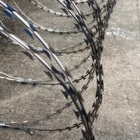 China Customized Stainless Steel Barbed Razor Concertina Coil Wire High Tensile Prison Fence for sale