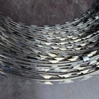 China Heavy Duty Razor Barbed Tape / Long Life Concertina Coil for Factory Fence for sale