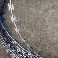 China Sharp Blade Razor Barbed Tape Concertina Long Life Industrial Security Barrier Wire for sale