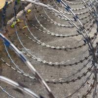China Hot Dip Galvanized Blade Barbed Concertina Razor Wire Extra Long Life Coil For Oil Refinery for sale