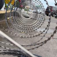 China Hot Dip Galvanized Concertina Razor Coil Wire / Sharp Blade Anti Intrusion For Military Perimeter for sale