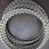China Stainless Steel 304 Concertina Razor Wire High Security Spiral Barrier For Border Protection for sale