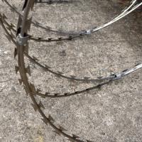 China Hot Dip Galvanized Concertina Razor Coil Wire / Sharp Blade Anti Intrusion For Military Perimeter for sale