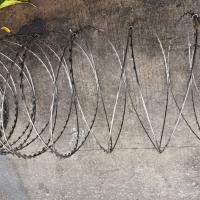 China 316 Marine Grade Barbed Wire Concertina Coil Salt Spray Resistant Barrier For Port Facilities for sale