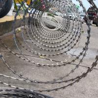 China Hot Dip Galvanized Blade Barbed Concertina Razor Wire Extra Long Life Coil For Oil Refinery for sale