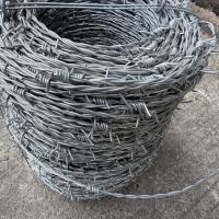 China Galvanized Concertina Wire, Single Coil Barbed Tape for Military Base Fence for sale