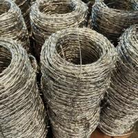 China Galvanized Concertina Wire, Single Coil Barbed Tape for Military Base Fence for sale