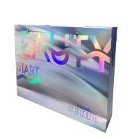 China boutique Custom Printed Paper Bags Holographic Shopping Bag With Ribbon Handle for sale