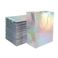 China boutique Custom Printed Paper Bags Holographic Shopping Bag With Ribbon Handle for sale